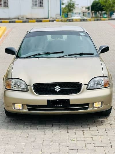Suzuki Baleno 2005 Islamabad number golden colour - Cars - 1087414719