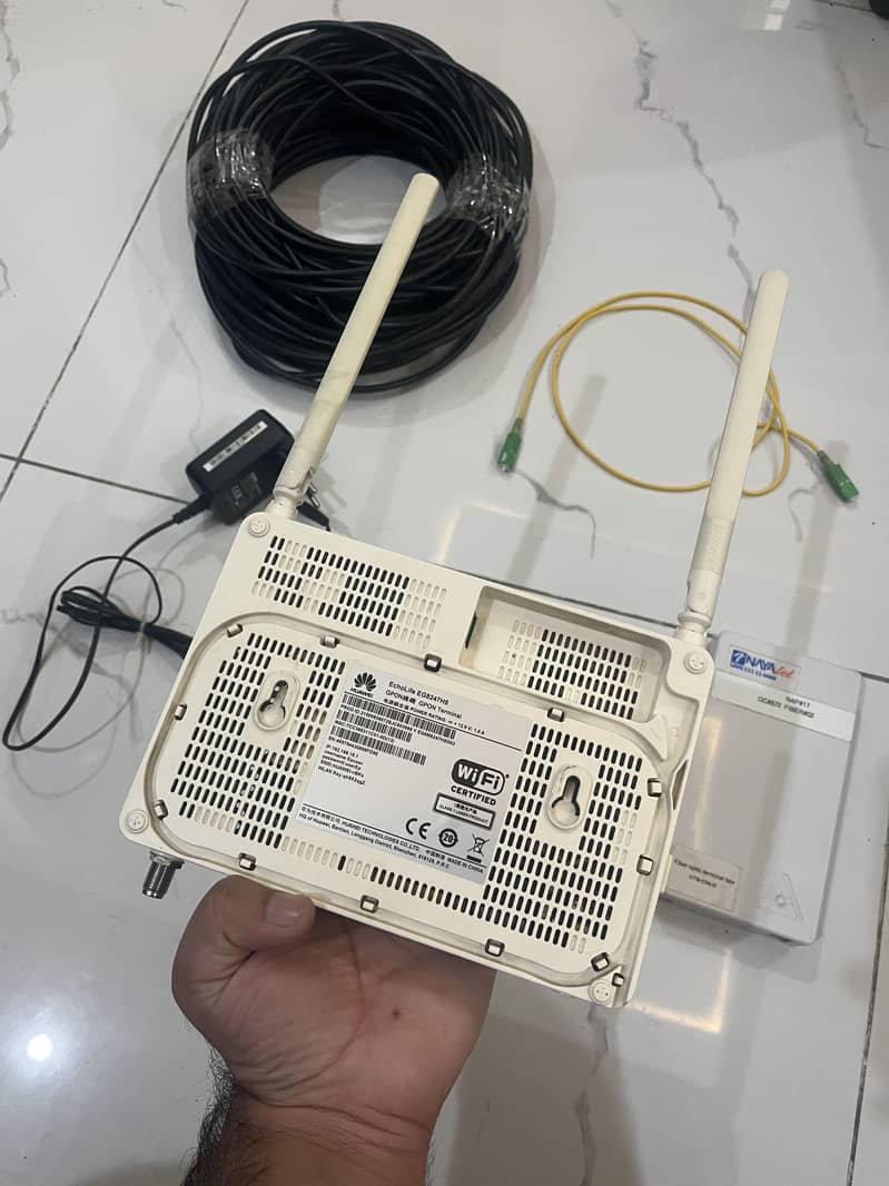 Nayatel Huawei Fiber optic GPON Router with 38 M Fiber Optic cable ...