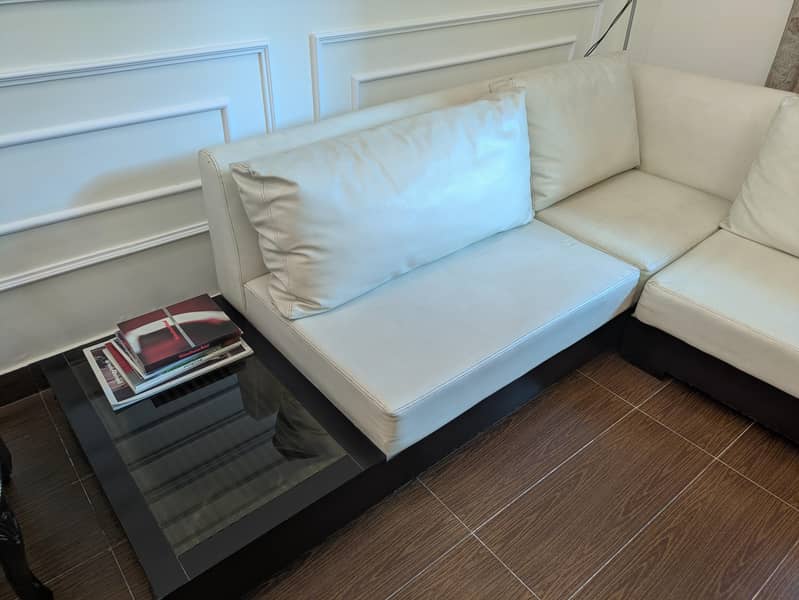 White Leather L Shape Sofa with Glass Top Attached Side Table - Sofas ...