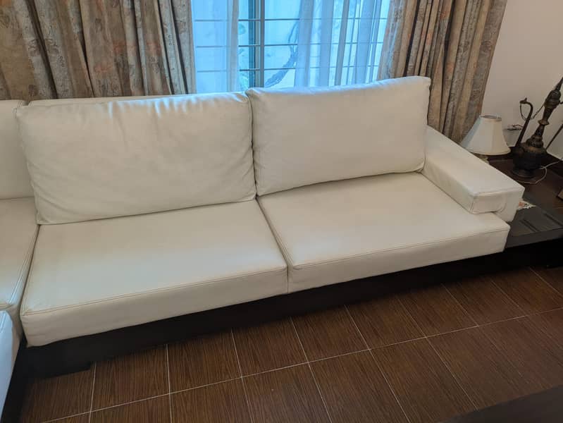 White Leather L Shape Sofa with Glass Top Attached Side Table - Sofas ...